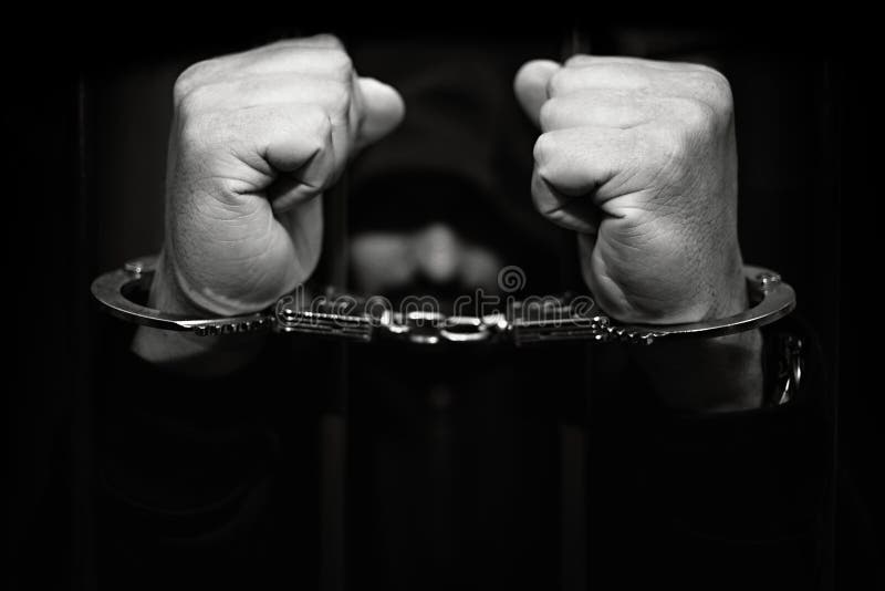 Homme Triste Avec Des Menottes En Prison Image stock - Image du homme ...