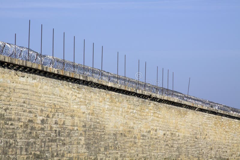 Prison wall. stock photo. Image of wire, brick, stone - 14026146