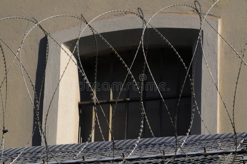 A prison window with bars stock image. Image of penal - 263426663