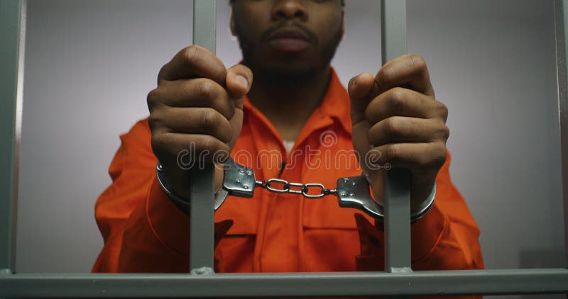 Prisoner Keeps Hands in Handcuffs on Jail Cell Stock Image - Image of ...