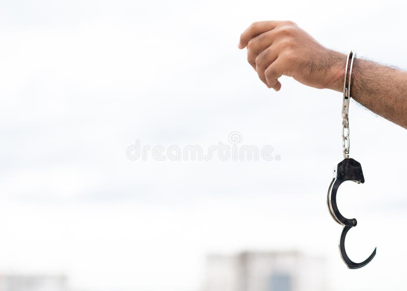 Prisoner Man in Jail with Handcuffs. Close Up Shackled in Hands Stock ...