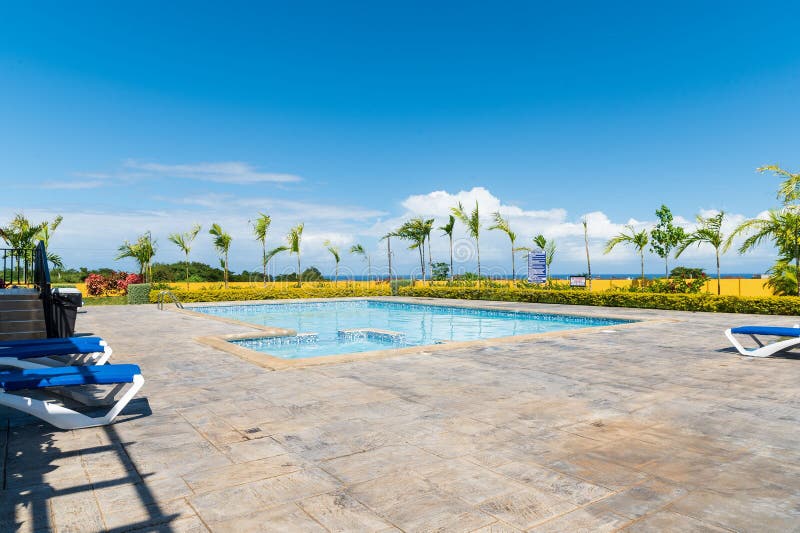 Pristine, Azure Swimming Pool Against the Blue Sky Stock Photo - Image ...