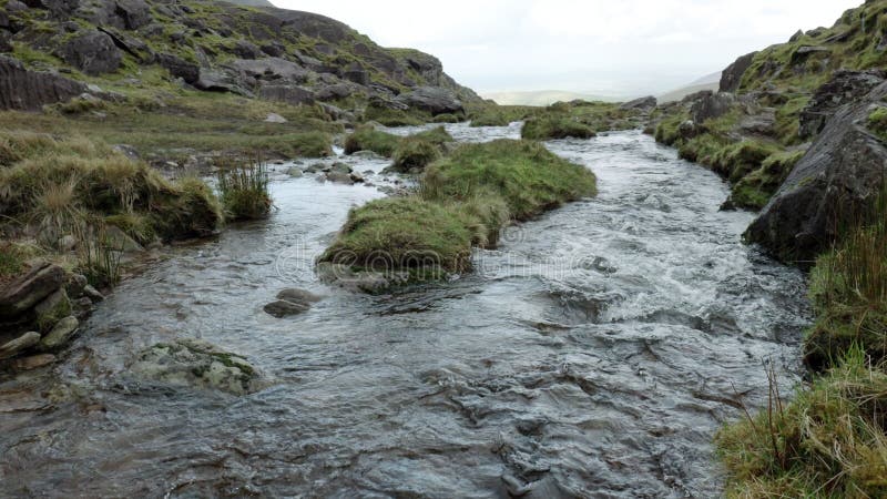A Pristine Mountain Stream Meandering through Rocky Terrain Under a ...