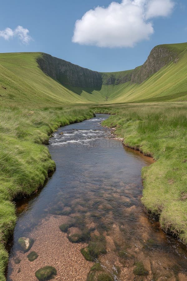 A Pristine River Flows Gently through a Vibrant Green Valley ...