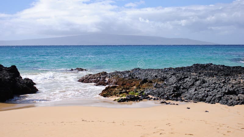 Private Beach with Sand and Lava Rocks in Maui Hawaii Stock Photo ...