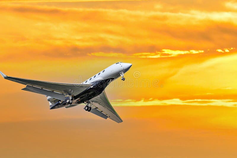 Private Business Plane Flying Under Orange Sky Stock Photo - Image of ...