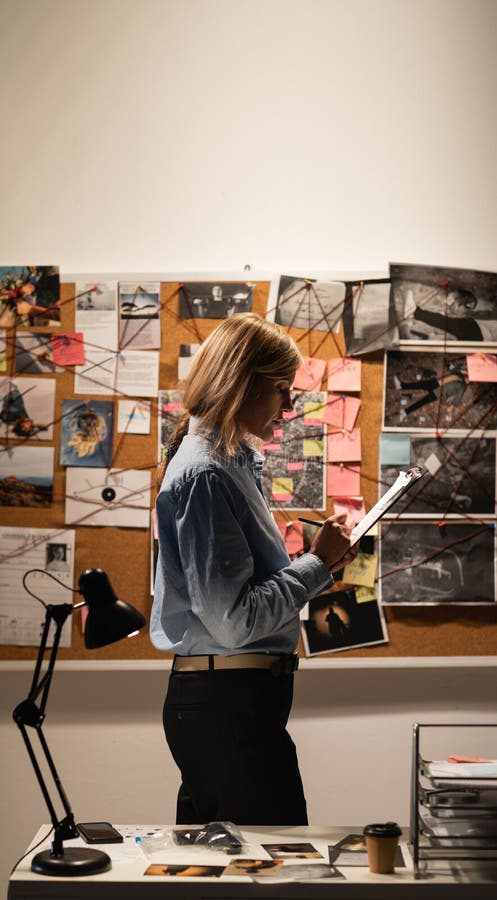 Private Detective in Uniform Over Workplace with Documents while ...