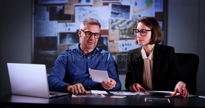 Private Detectives Doing Crime Investigation in Office Stock Image ...