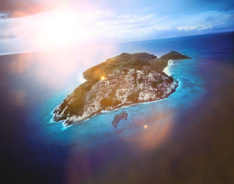 Private Island in the Ocean with Sun Shining Stock Photo - Image of ...