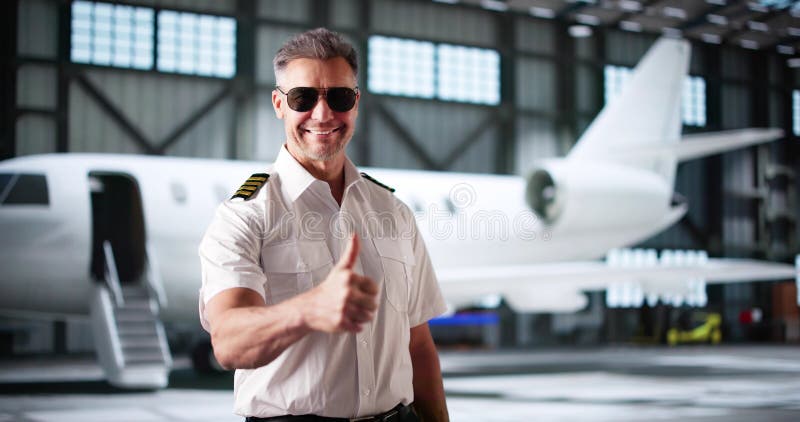 Private Jet Captain Pilot in Uniform. Small Airplane Stock Photo ...