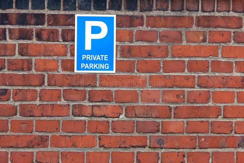 Private Parking Sign on Red Brick Wall Stock Photo - Image of ...