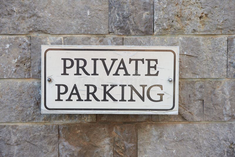 Private Parking Sign on a Stone Wall Stock Photo - Image of outside ...