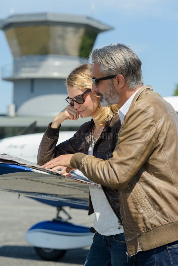 Private Plane Pilot Explaining Route To Client Stock Image - Image of ...