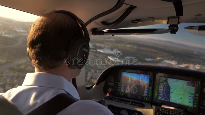 Private Plane Pilot Navigating and Flying into Sunset Stock Video ...