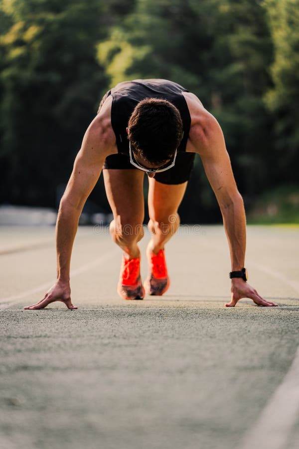 Pro Runner Ready To Go during the Race on the Running Track. Vertical ...