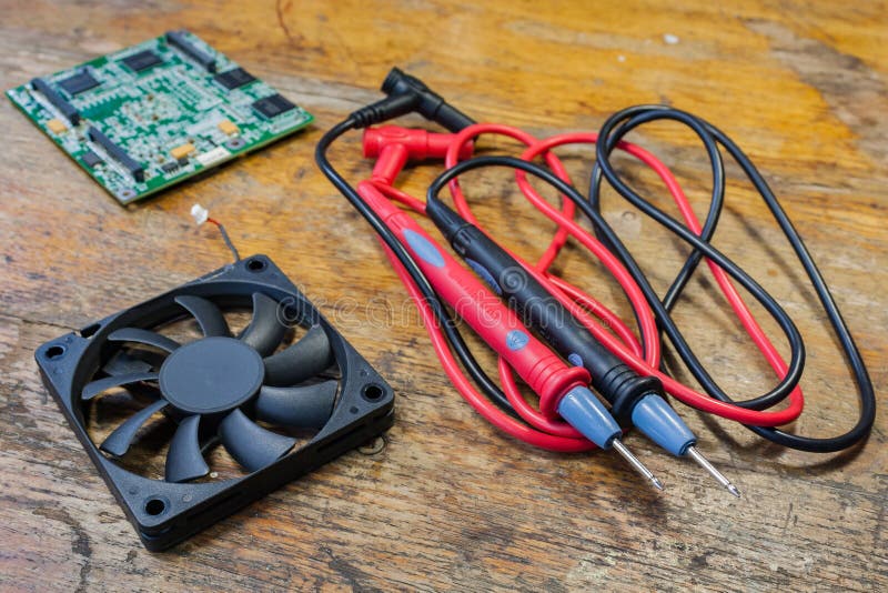 Probes for a Multimeter and Electronic Components on a Table in a ...