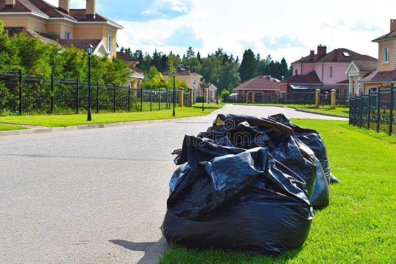 Big Black Trash Bag on the Lawn. Cleaning the Area Stock Image - Image ...