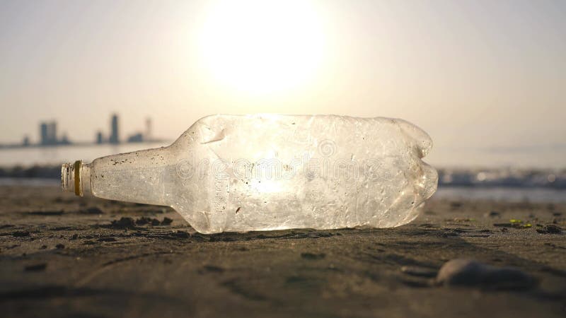 Problem of Plastic Garbage Discarded Bottle at Sunset Sea Beach Close Up Pet Bottles Stock Video ...