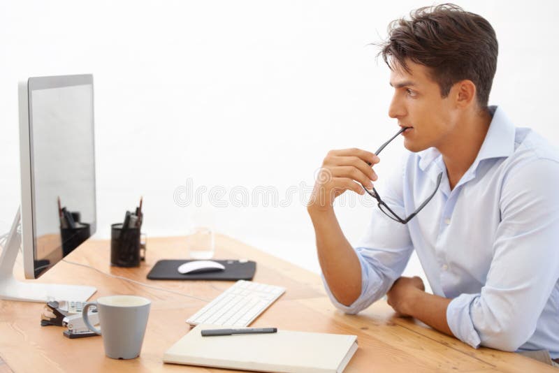 Problem Solving is His Forte. a Young Businessman Biting His Glasses ...