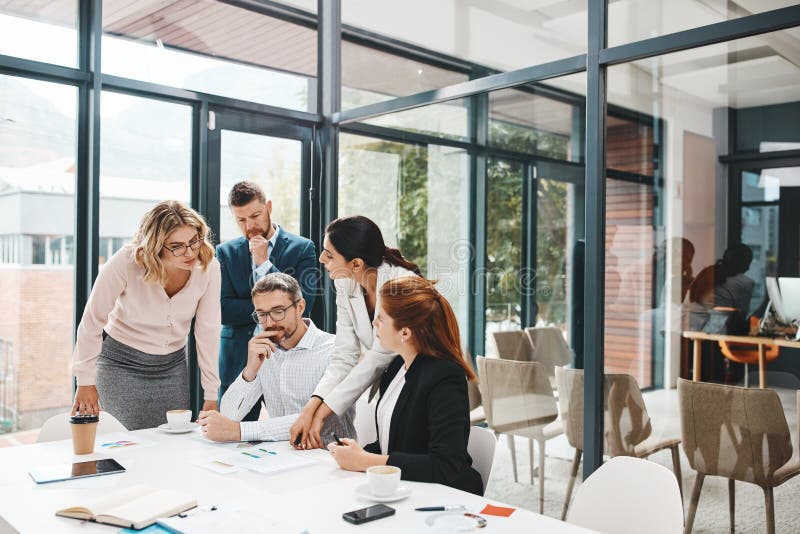 Problem-solving is a Team Effort. a Group of Businesspeople Having a ...