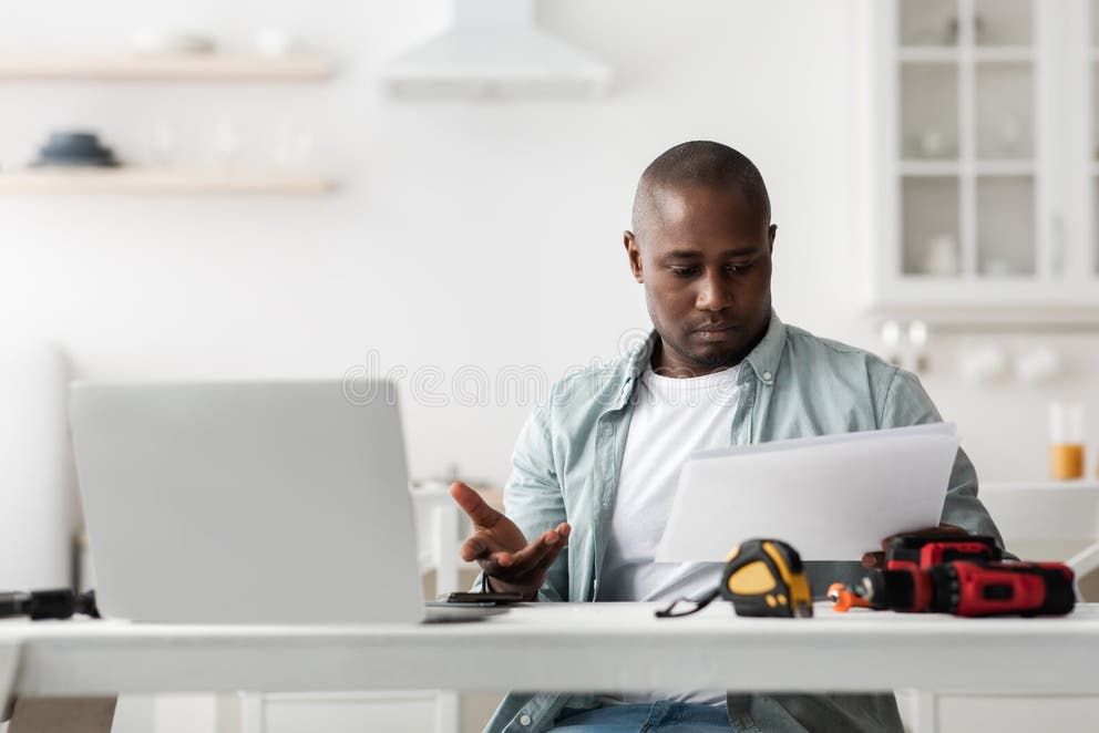 Problems with Instructions. Puzzled Black Handyman Reading Manual and ...