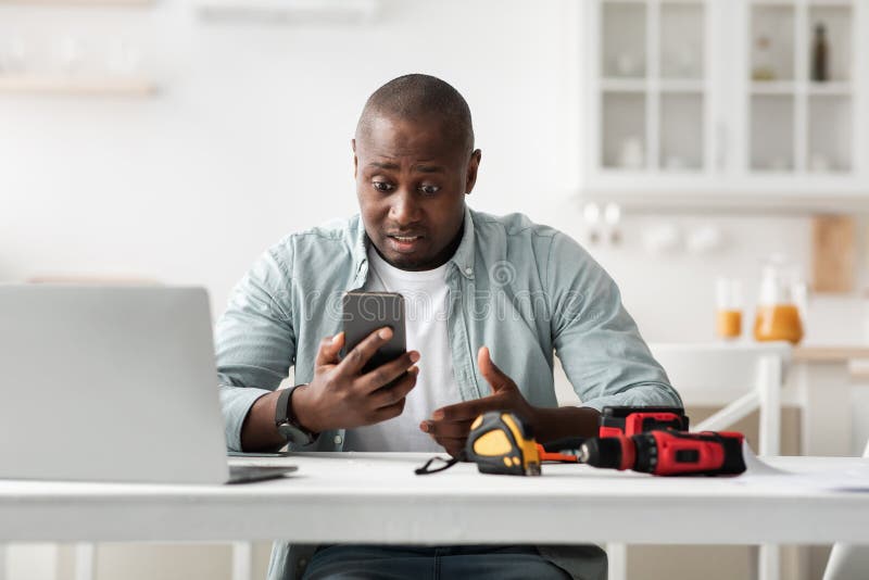 Problems with instructions and service. Shocked black man with tools ...