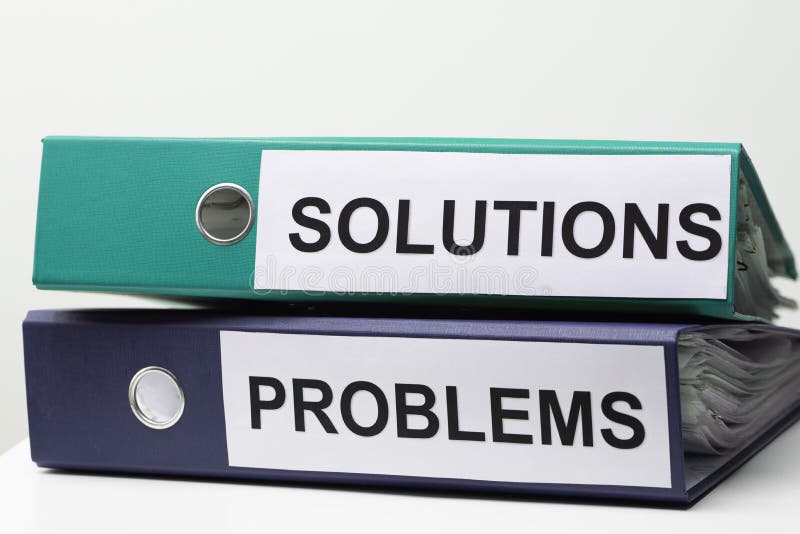 Problems and Solutions - Two Binders with Text on Desk in the Office ...