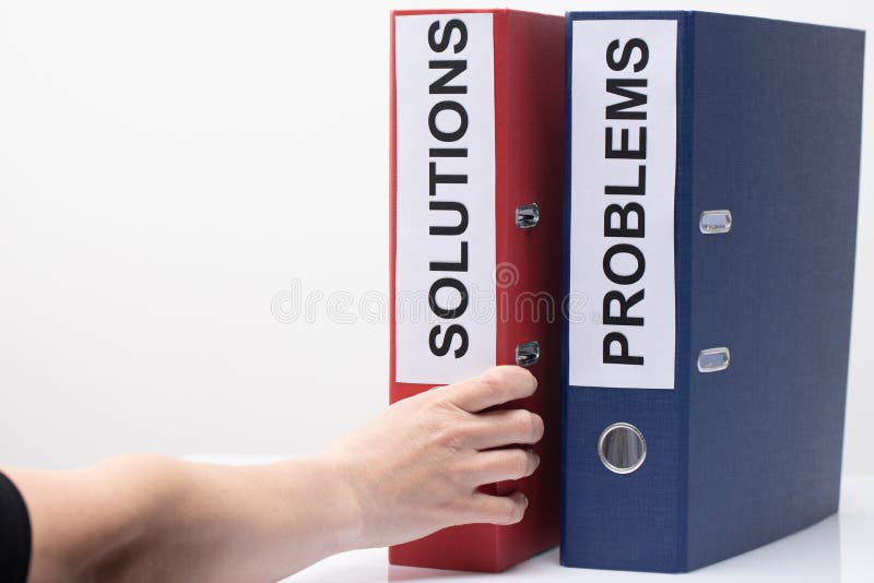 Problems and Solutions - Two Binders with Text on Desk in the Office ...