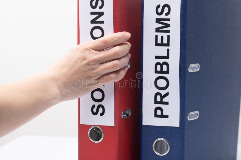 Problems and Solutions - Two Binders with Text on Desk in the Office ...