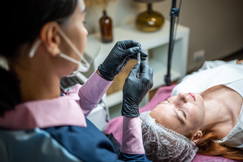 Procedure of Eyebrow Microblading. a Master in Black Gloves is Doing a ...