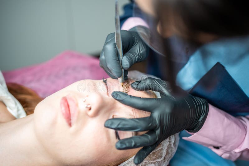 Procedure of Eyebrow Microblading. a Master in Black Gloves is Doing a ...