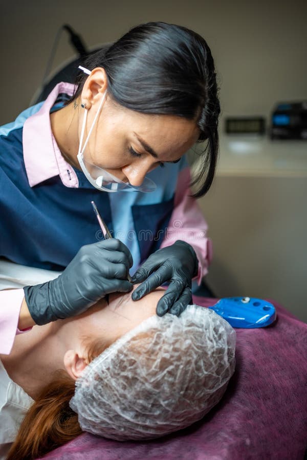 Procedure of Eyebrow Microblading. a Master in Black Gloves is Doing a ...
