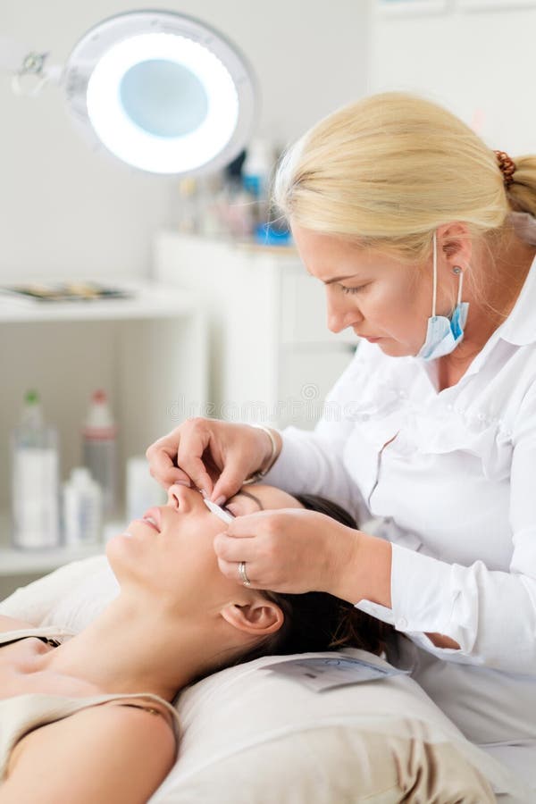 Procedure of Eyelash Extension in Salon by Cosmetician Stock Photo ...
