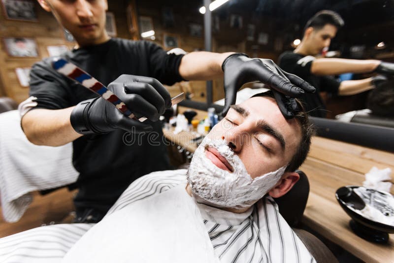 Man in shaving salon stock photo. Image of hand, luxury - 100143866