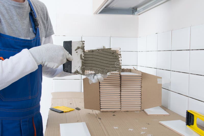 The Process of Applying the Adhesive Solution with a Metal Spatula on ...