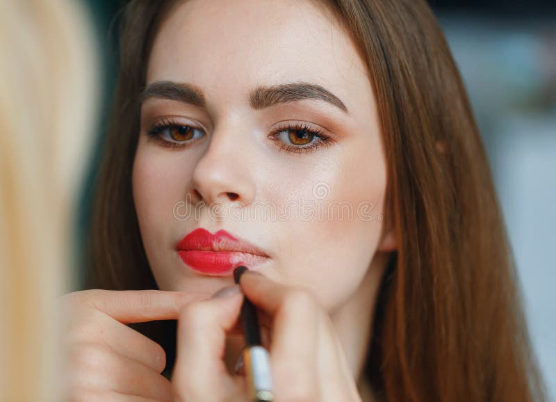 Process of Applying Lipstick on the Face of the Model Stock Photo ...