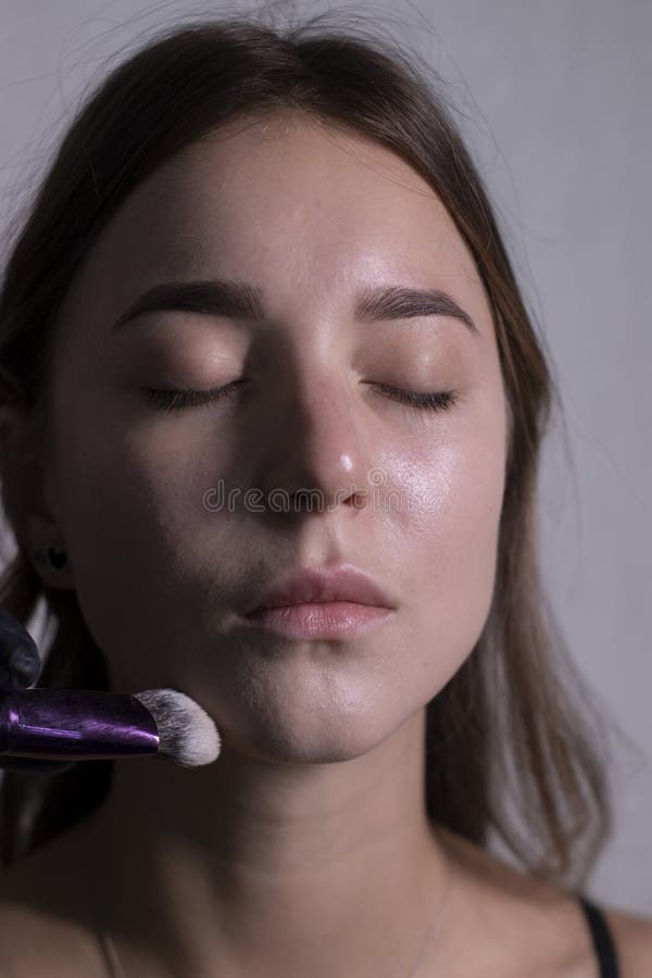The Process of Applying Makeup To a Beautiful Brunette. Beauty ...