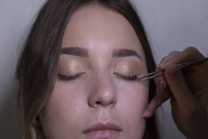 The Process of Applying Makeup To a Beautiful Brunette. Beauty ...