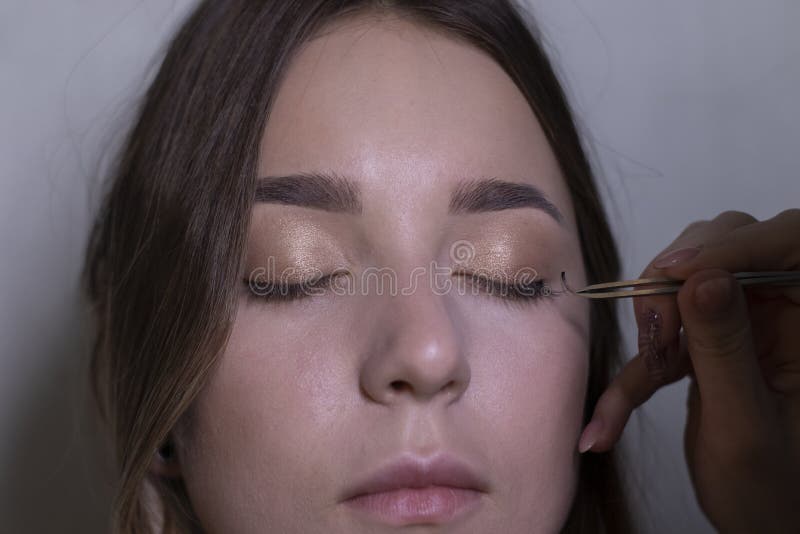 The Process of Applying Makeup To a Beautiful Brunette. Beauty ...