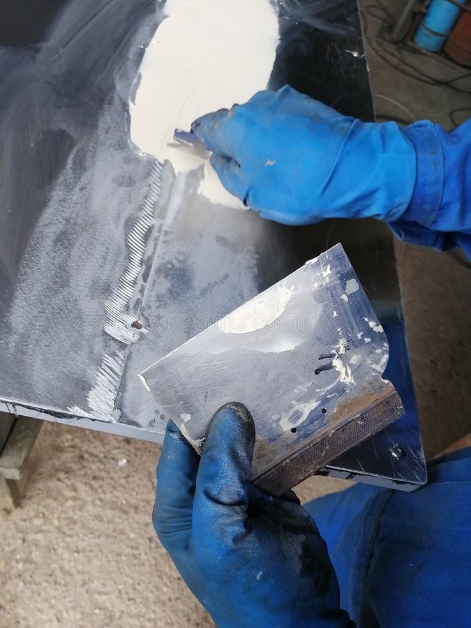 Process of Applying Putty on a Gray Surface Stock Photo - Image of ...