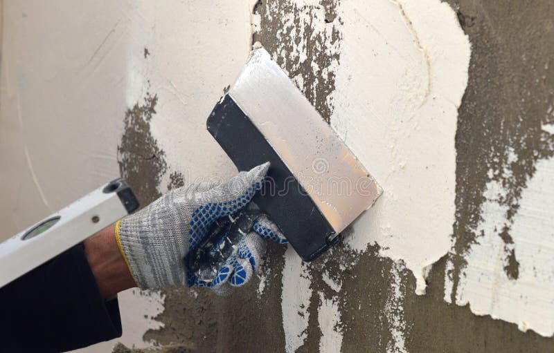 Applying Putty To The Wall Using A Spatula Stock Photo - Image of wall ...