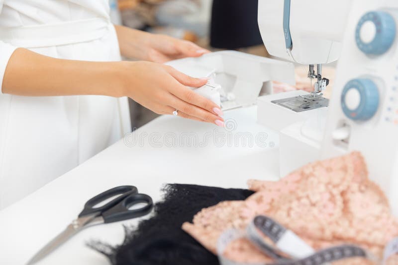 Process of Assembling Sewing Machine, Hands Set Box Under Threads Stock ...