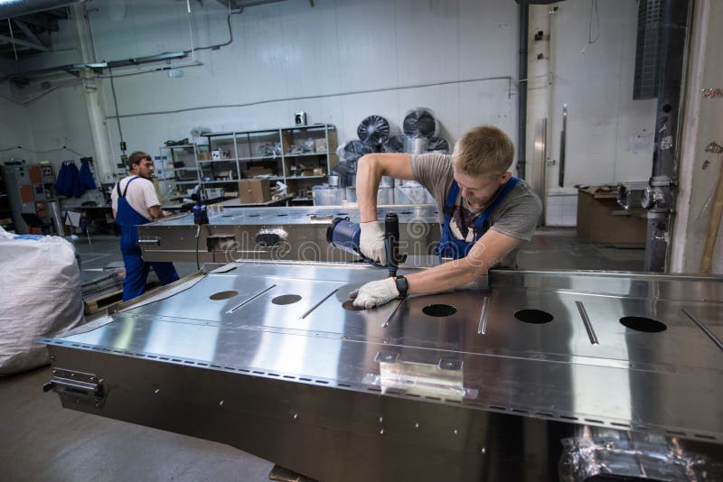 The Process of Assembling the Ventilation Duct of an Electric Tr ...