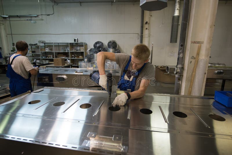 The Process of Assembling the Ventilation Duct of an Electric Tr ...