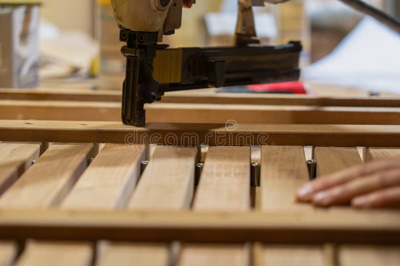 The Process of Assembling a Wooden Structure Close-up Using a ...