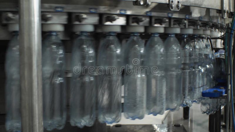 Automatic Bottle Rinsing, Filling and Capping Machine. Automation of ...
