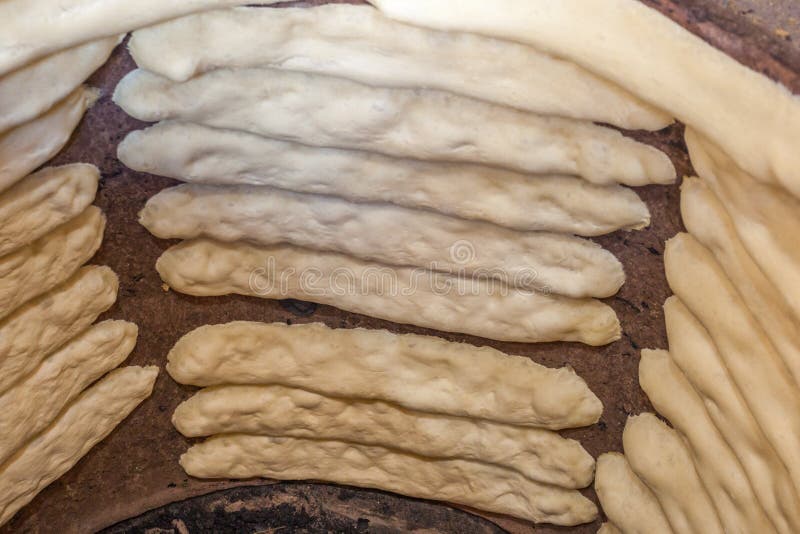 The Process of Baking Bread in a Traditional Georgian Stove Stock Image ...