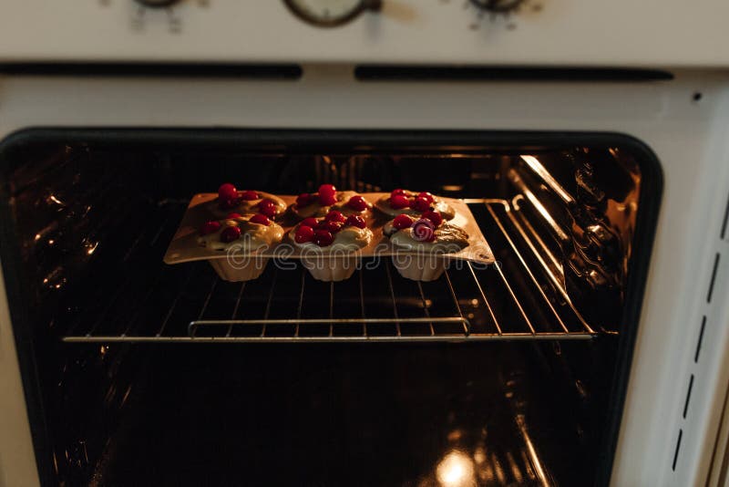 The Process of Baking Cupcakes in the Oven. Dough for Baking Cupcakes ...