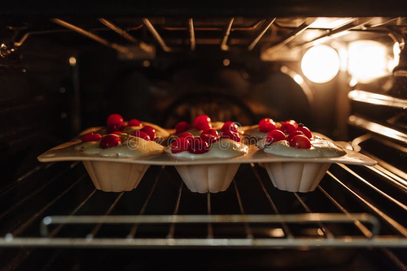 The Process of Baking Cupcakes in the Oven. Dough for Baking Cupcakes ...