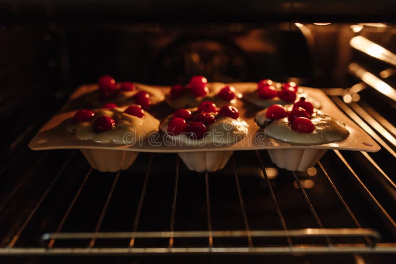 The Process of Baking Cupcakes in the Oven. Dough for Baking Cupcakes ...
